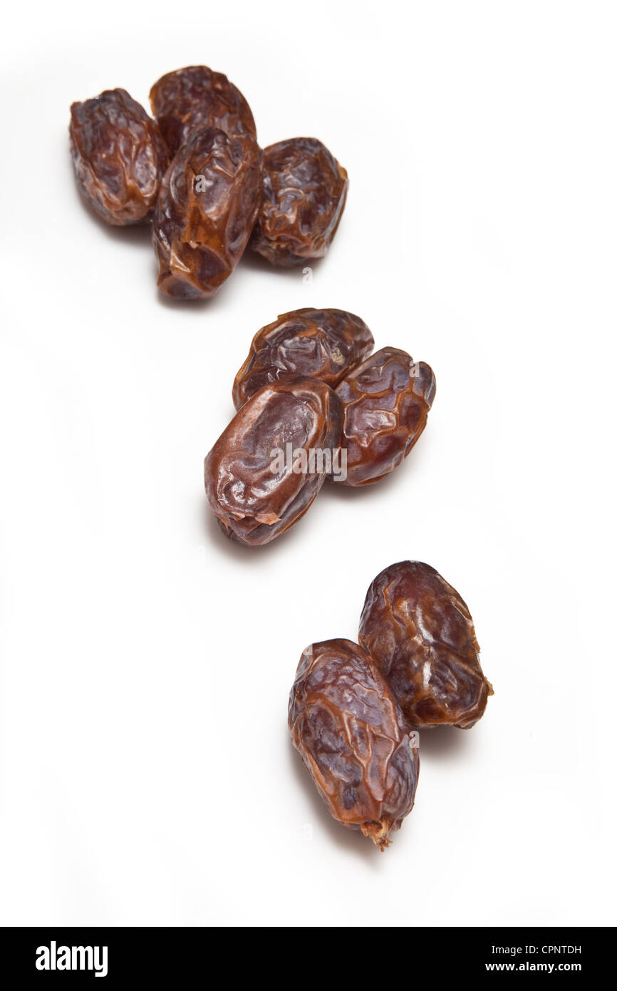 Dried Medjool dates isolated on a white studio background Stock Photo ...