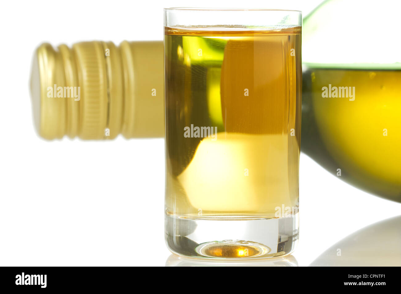 alcohol glass and bottle with reflection on white background Stock ...