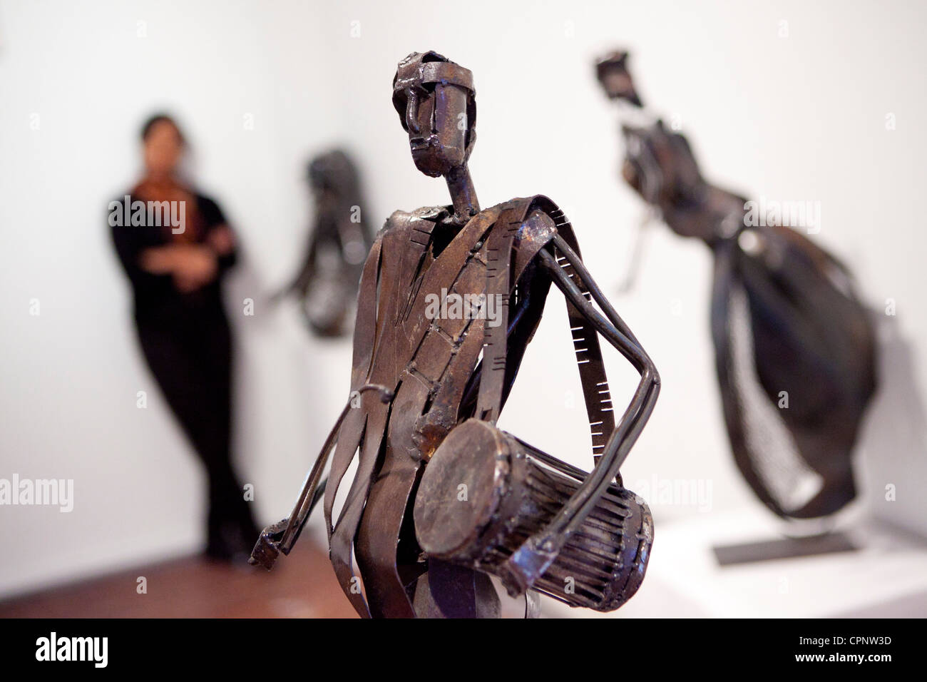 Artist looking at a work of art sculpture Stock Photo - Alamy