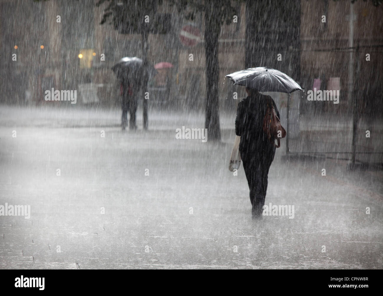 Heavy rain umbrella hi-res stock photography and images - Alamy