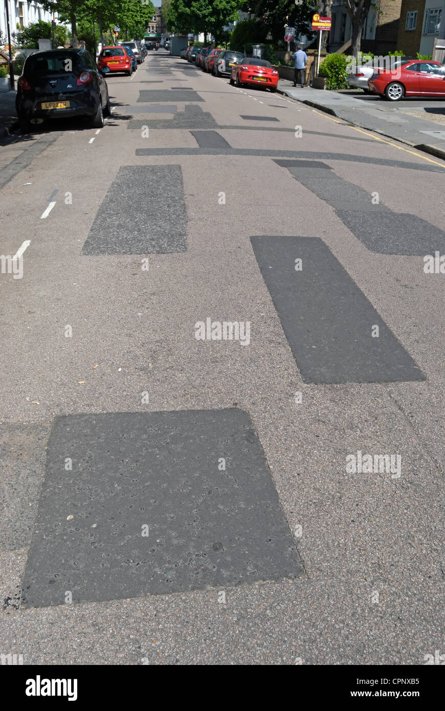 road surface repairs creating a patchwork effect, in ealing, west ...