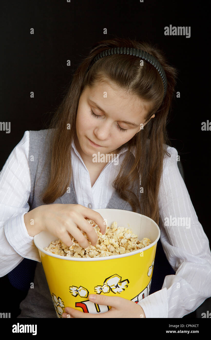 girl asleep in a movie theater with popcorn Stock Photo - Alamy
