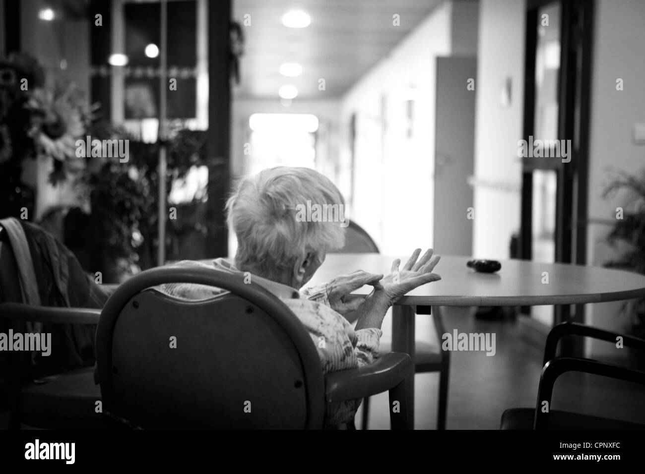 Senior inside home back view Black and White Stock Photos & Images - Alamy