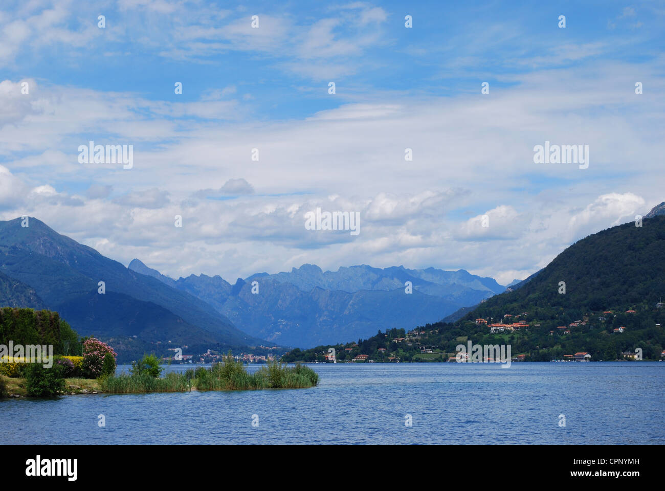 Panoramic view of Orta lake in summer with Alps mountains in background ...
