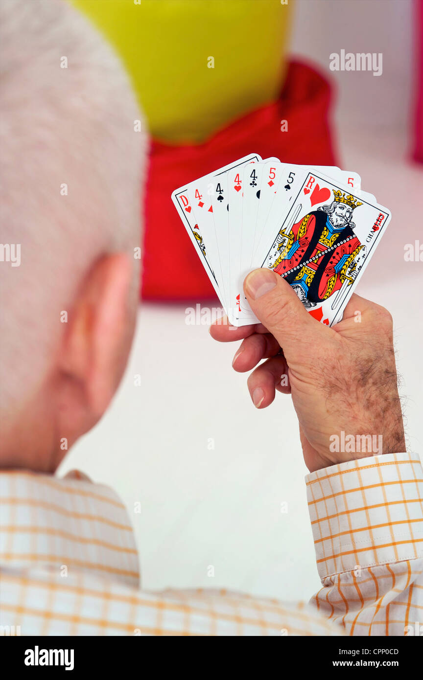 ELDERLY PEOPLE PLAYING CARDS Stock Photo - Alamy