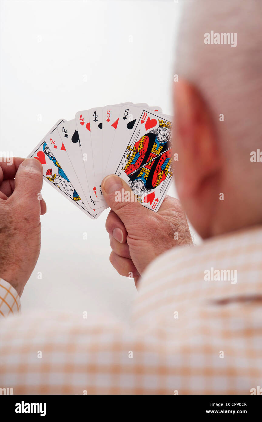 ELDERLY PEOPLE PLAYING CARDS Stock Photo - Alamy