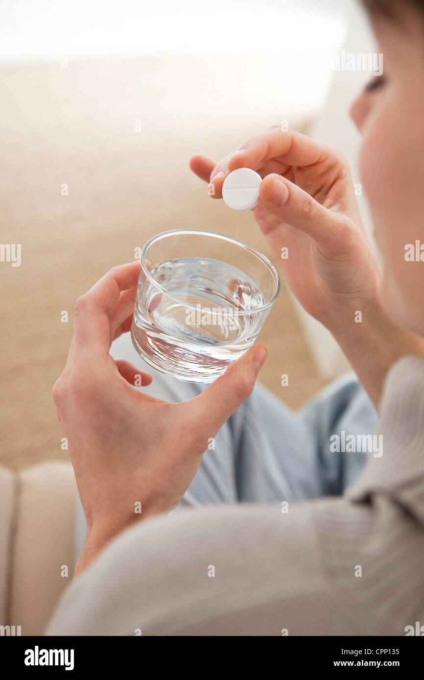 Taking drugs to treat pain hi-res stock photography and images - Alamy