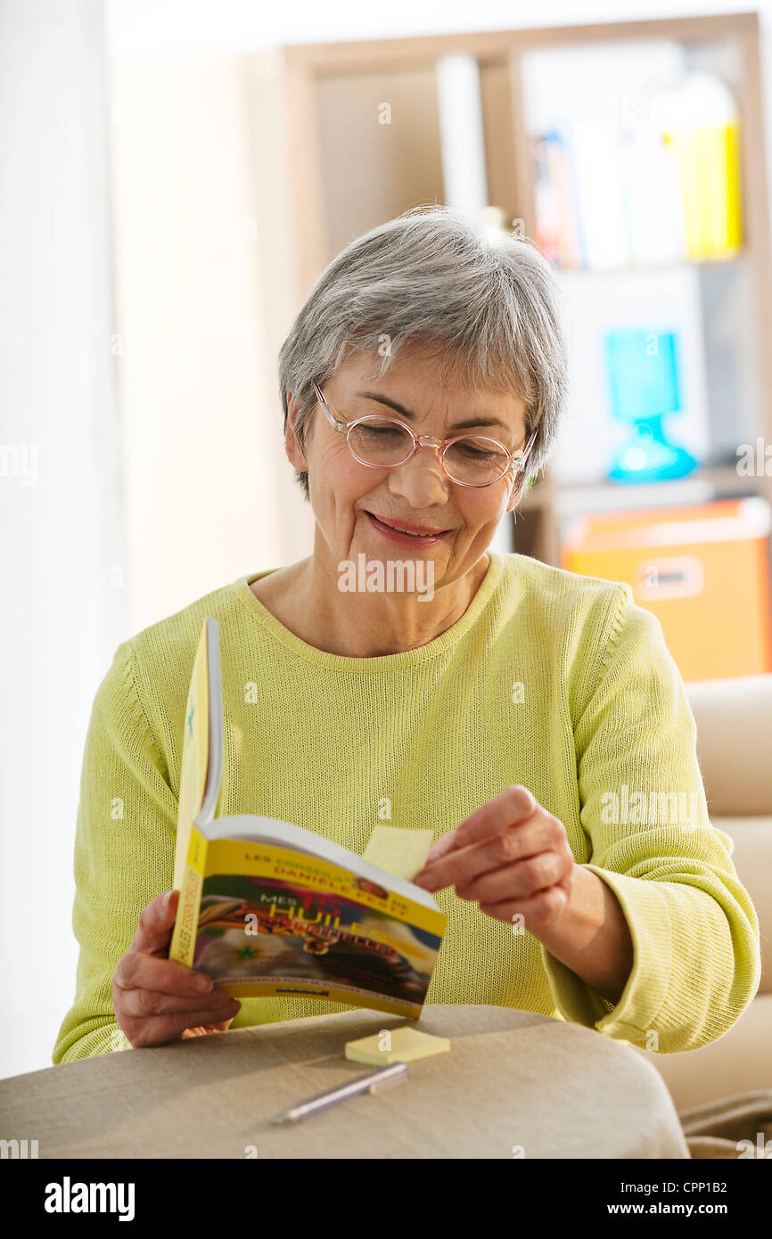 ELDERLY PERSON READING Stock Photo - Alamy