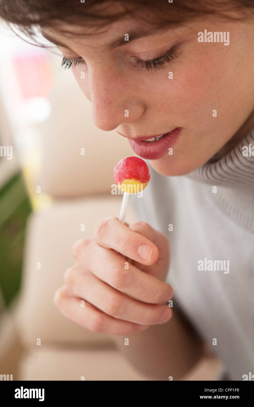WOMAN EATING SWEETS Stock Photo - Alamy
