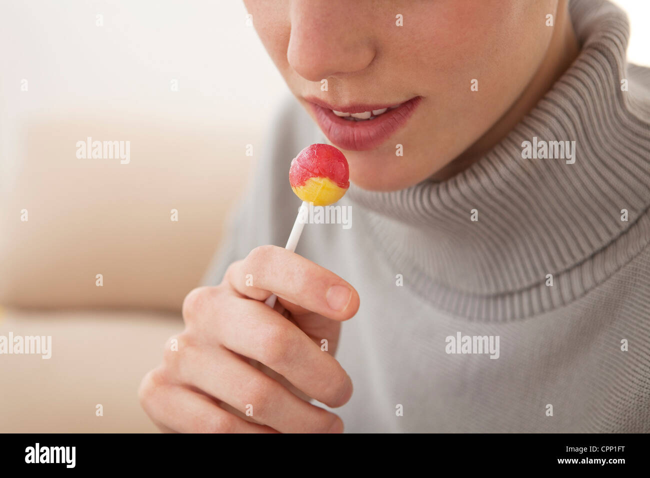 WOMAN EATING SWEETS Stock Photo - Alamy