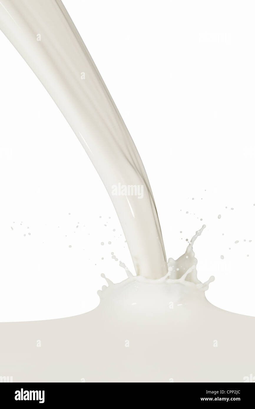 splashing milk isolated on white background Stock Photo - Alamy