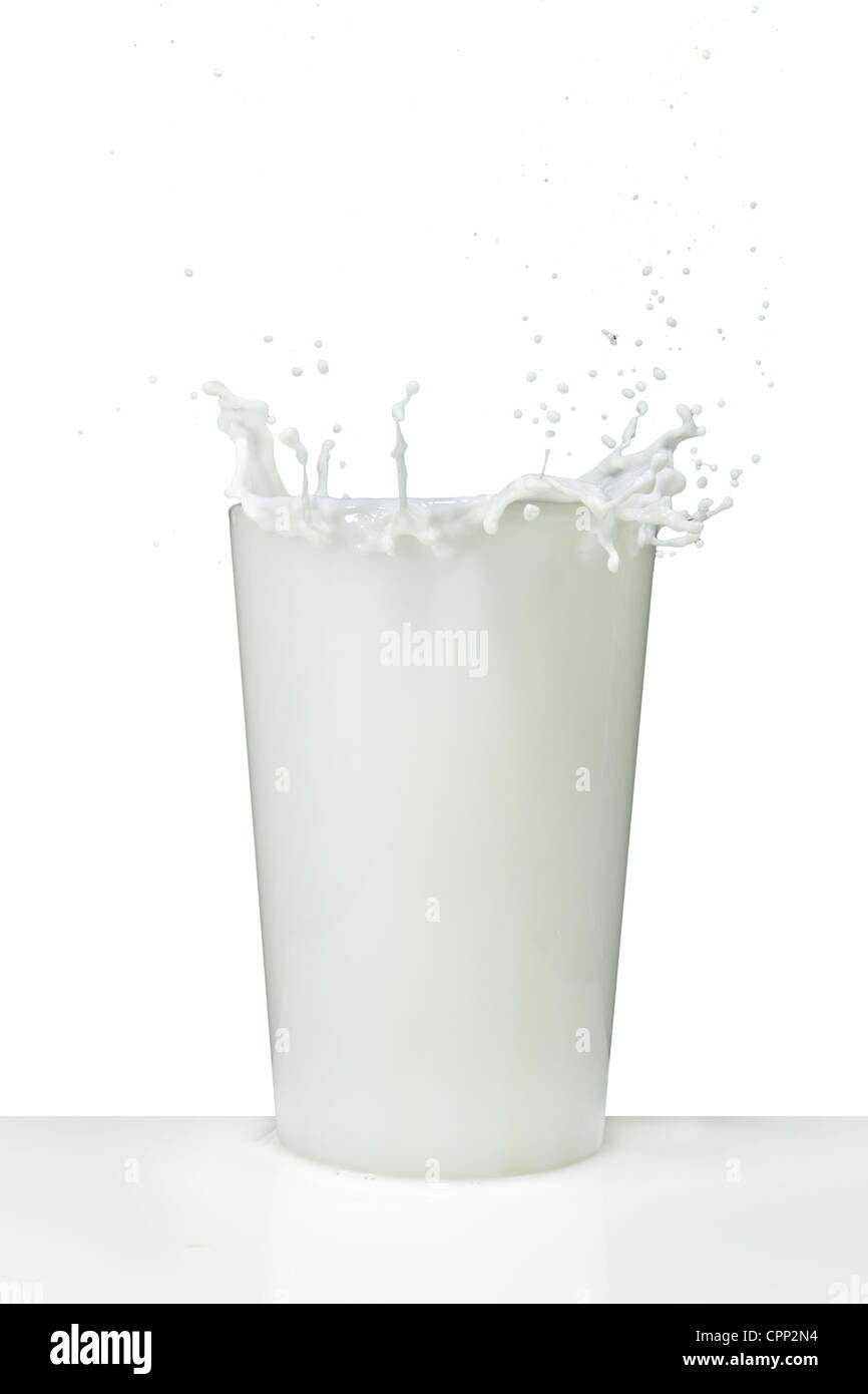 milk splashing from the glass Stock Photo - Alamy