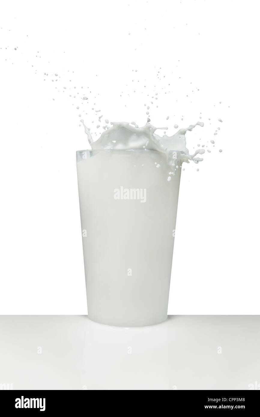 milk splashing from the glass Stock Photo - Alamy