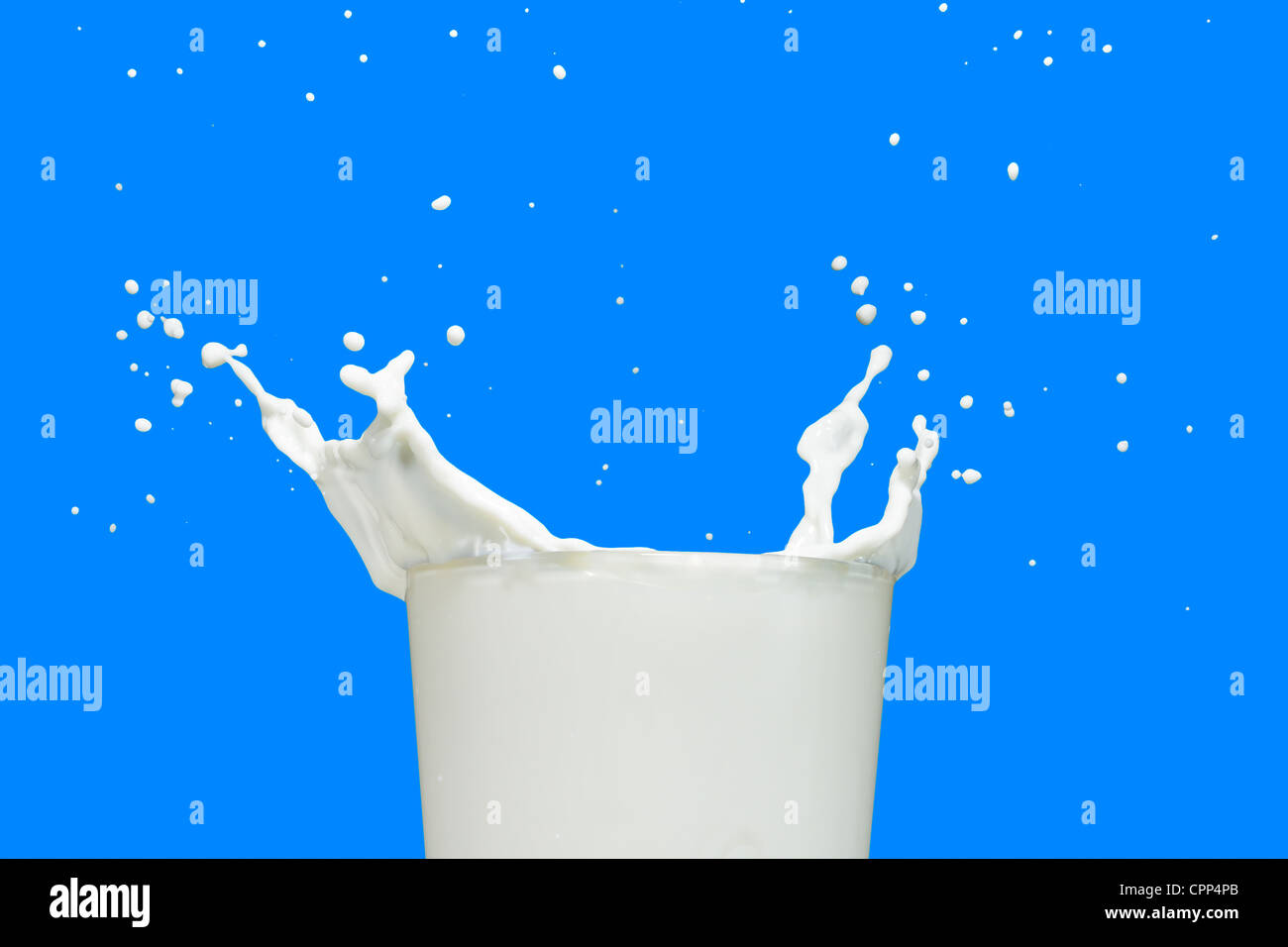 milk splashing from the glass Stock Photo - Alamy