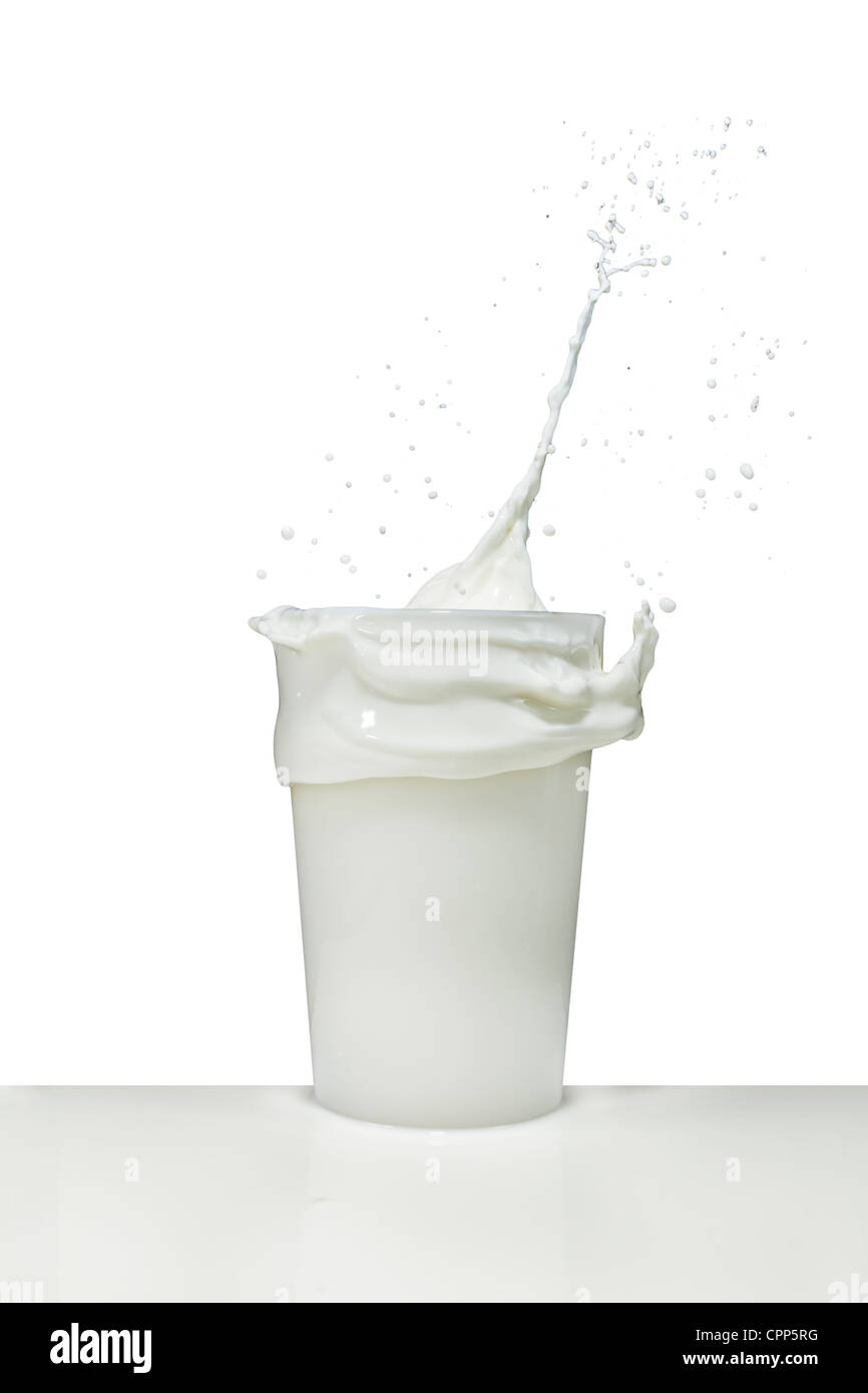 milk splashing from the glass Stock Photo - Alamy