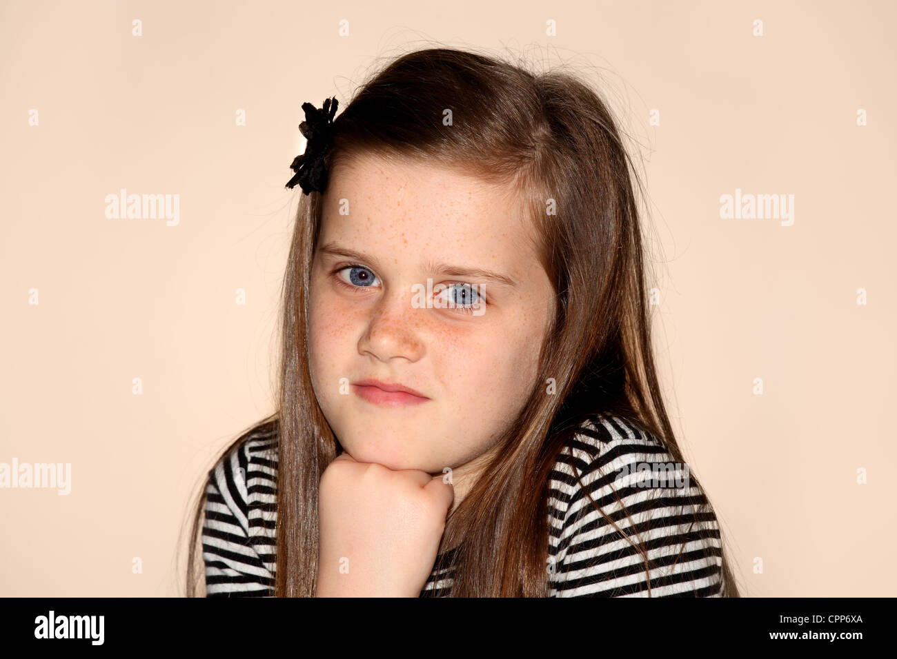 A nine year old girl smiling at the camera Stock Photo - Alamy