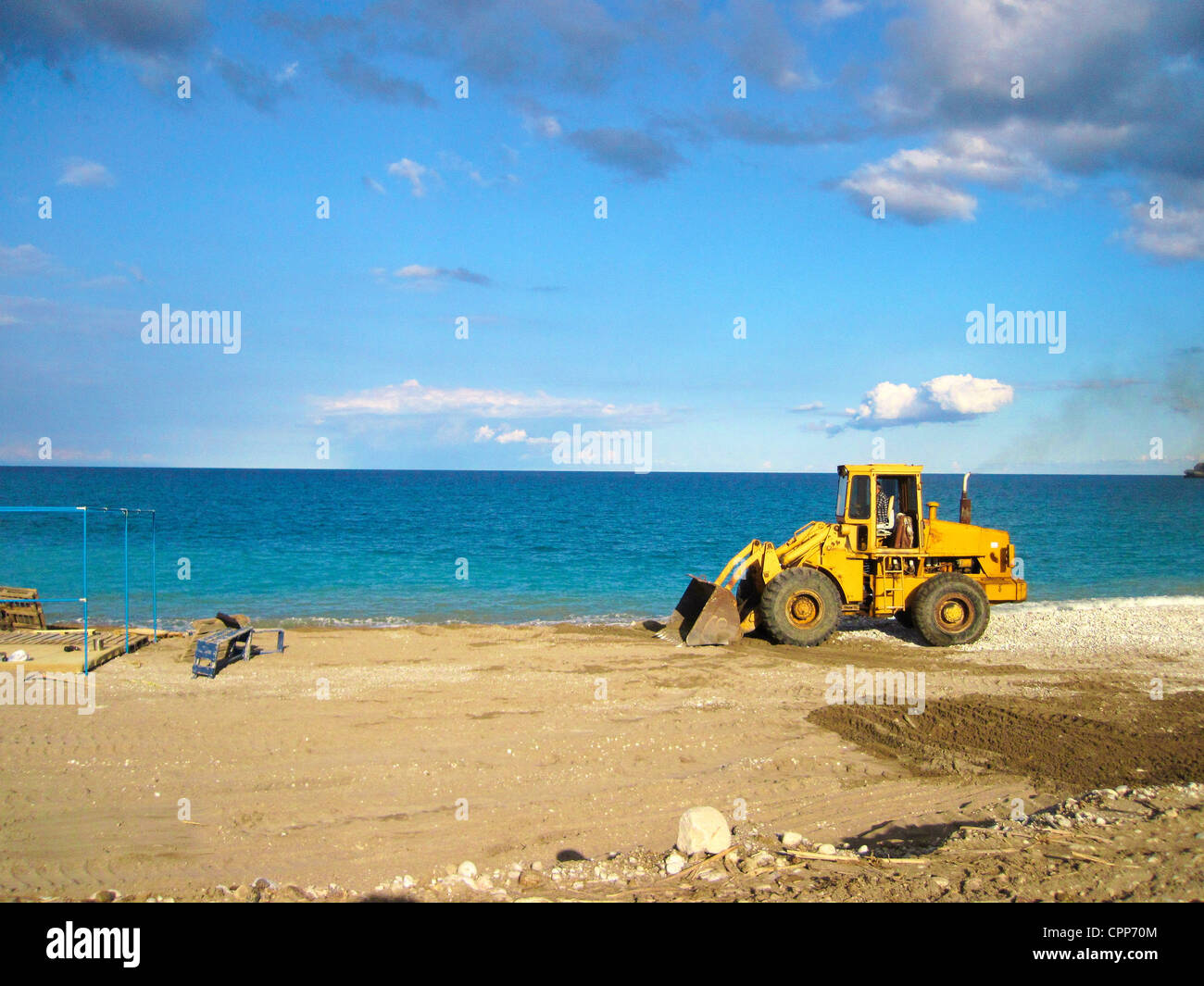 JCB digger grooms Afandou beach in Rhodes Greece Stock Photo - Alamy