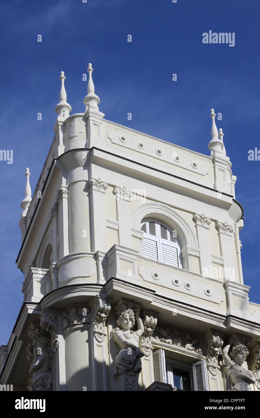 Corner tower of residential building against blue sky Stock Photo - Alamy