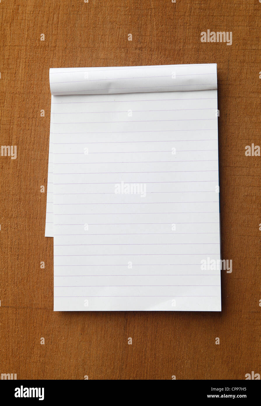 tear paper note on wood texture background Stock Photo - Alamy