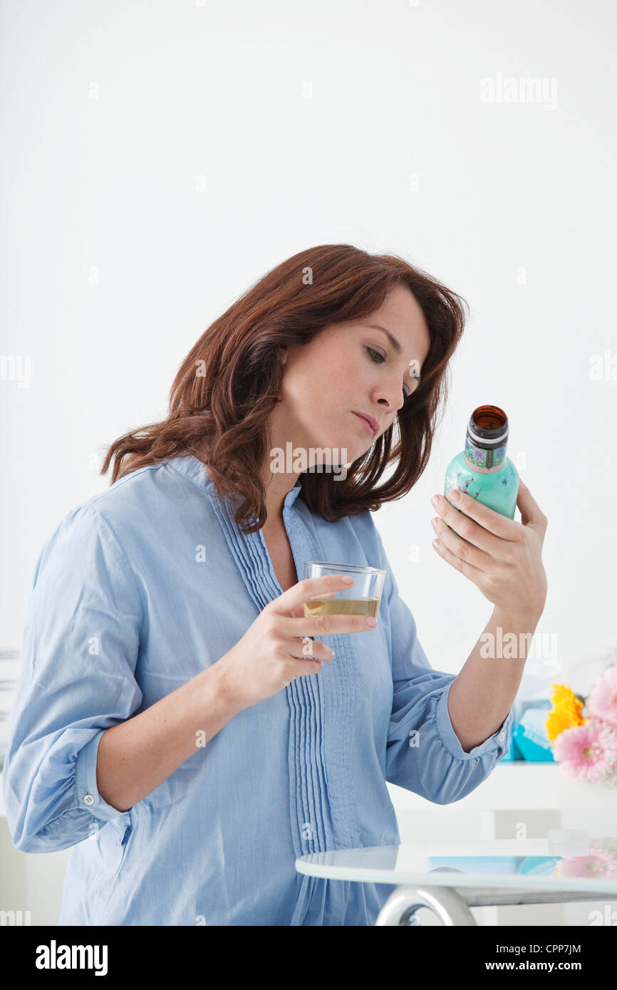 WOMAN WITH COLD DRINK Stock Photo - Alamy