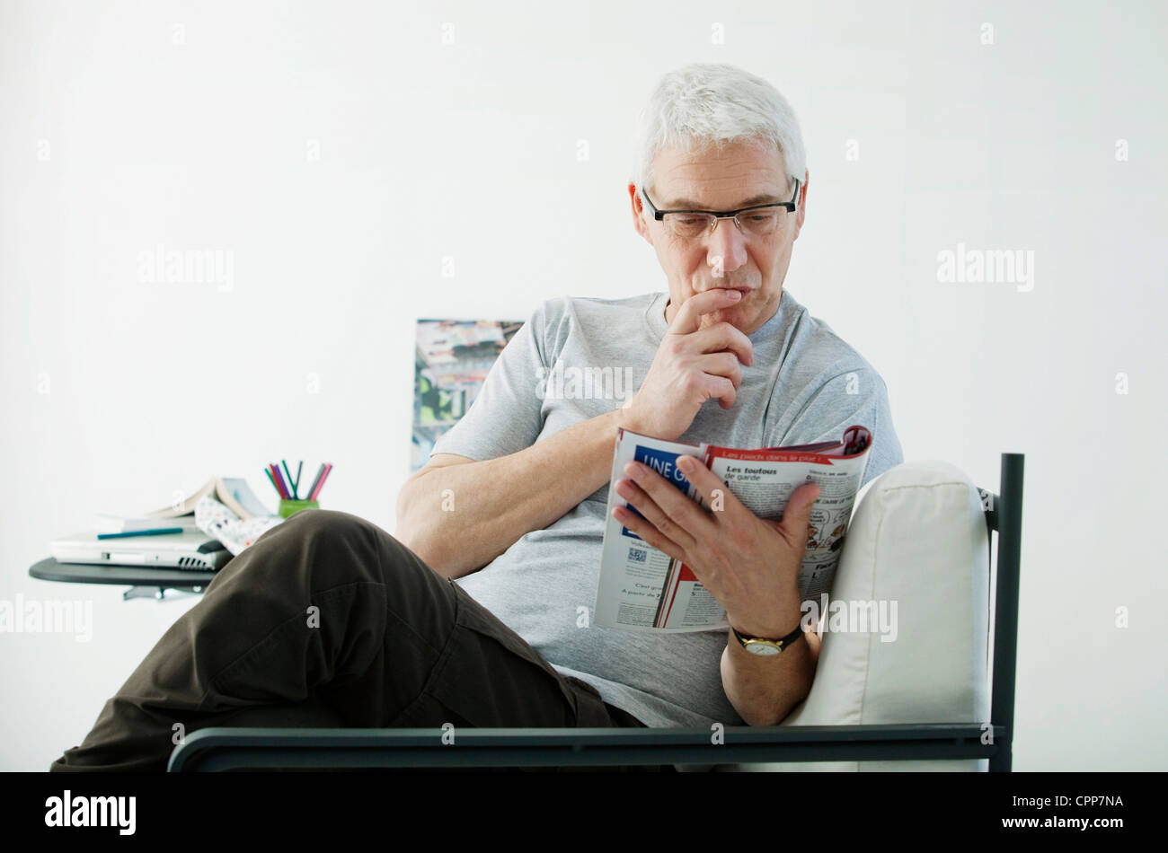 ELDERLY PERSON READING Stock Photo - Alamy