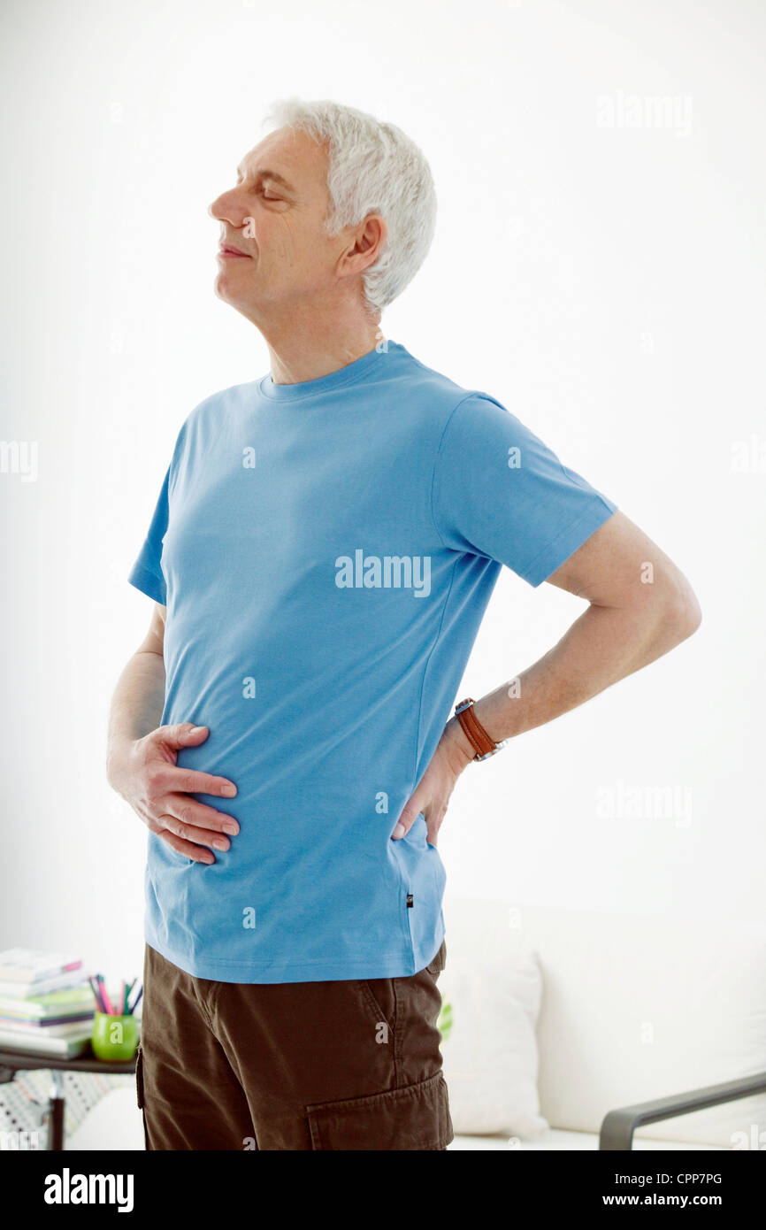 LOWER BACK PAIN IN ELDERLY PERS Stock Photo - Alamy