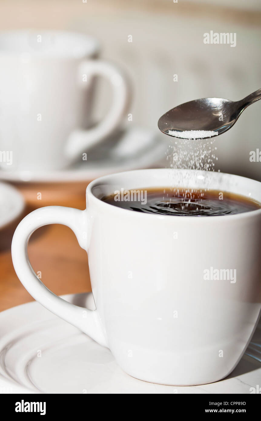 Cup of coffee with white suger Stock Photo - Alamy
