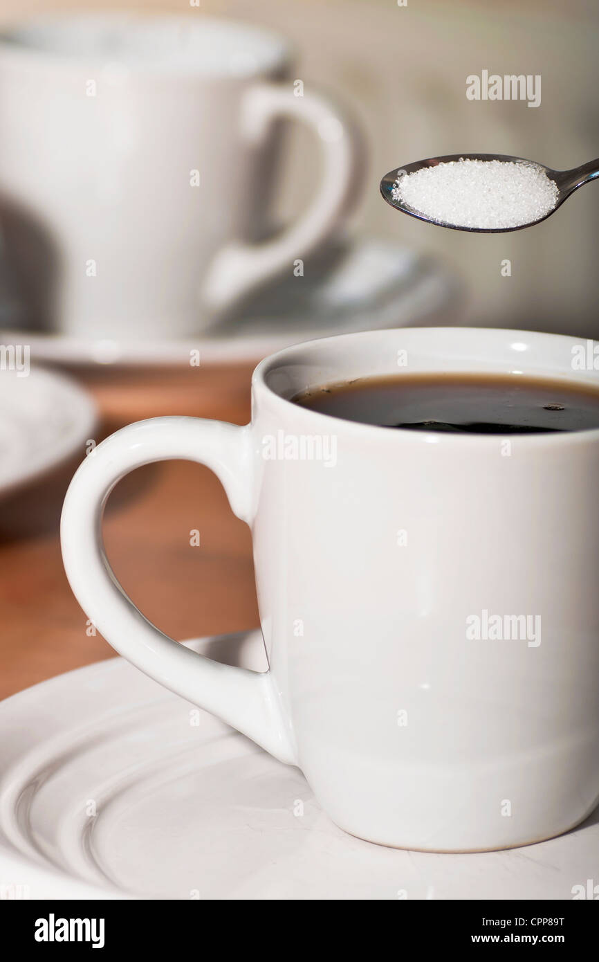 Cup of coffee with suger Stock Photo - Alamy