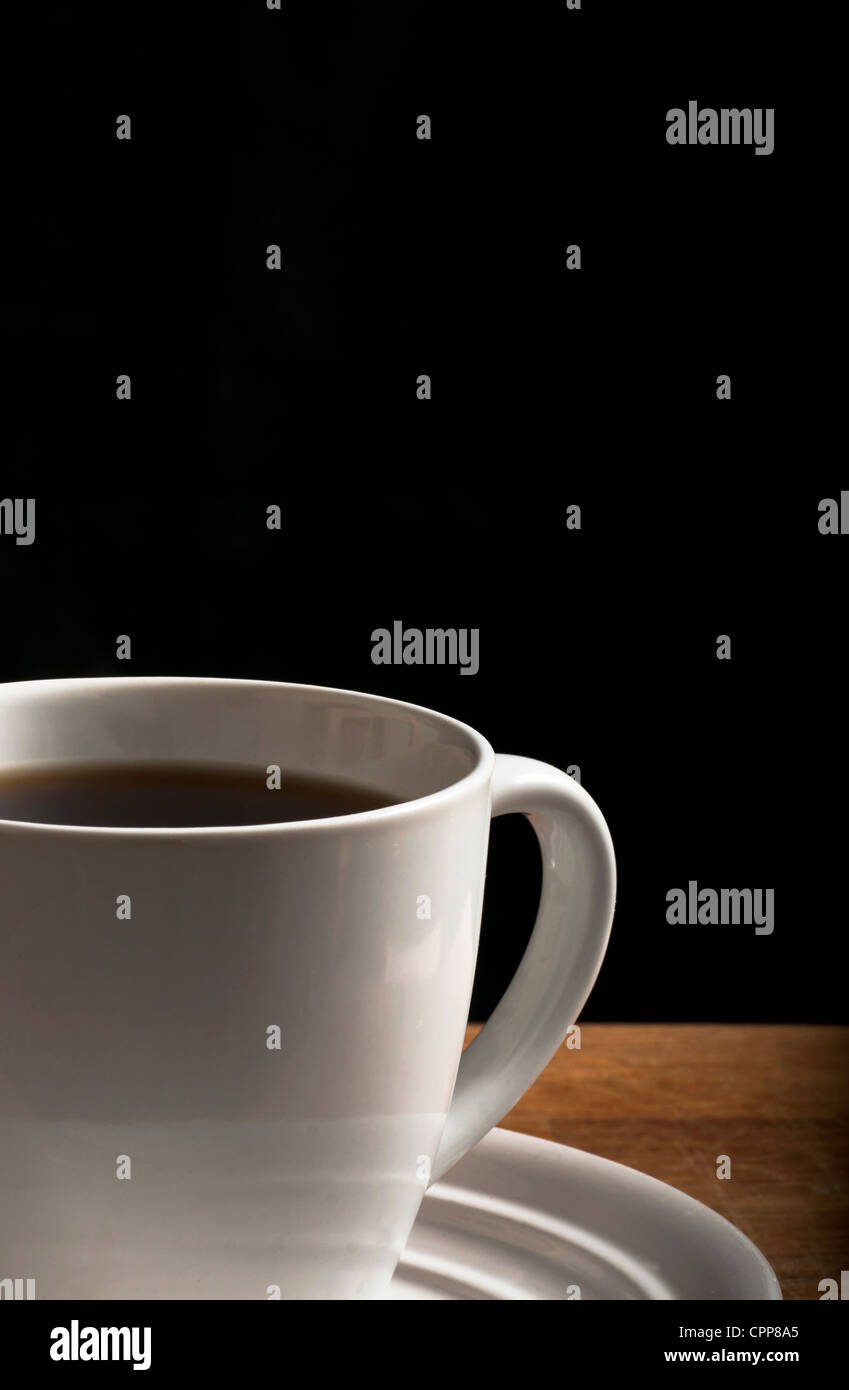 Cup of coffee low key Stock Photo - Alamy