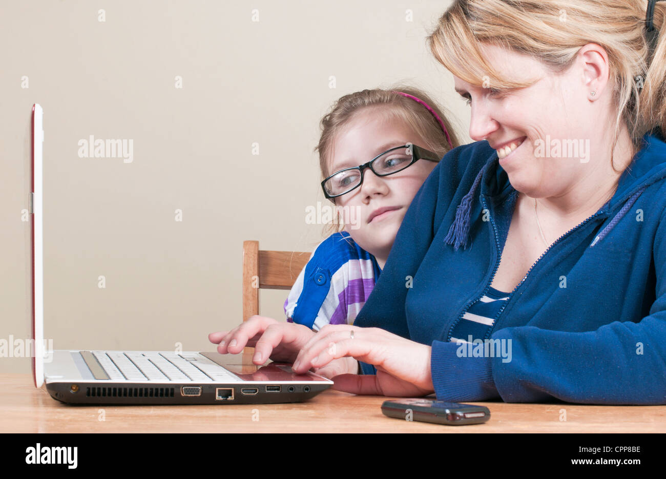 Family using a laptop computer Stock Photo - Alamy