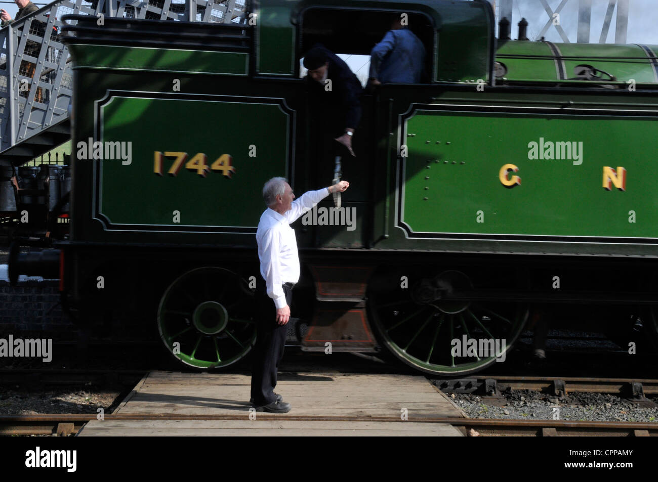 The Highley signal man receives the token from the fireman of 1744 in ...