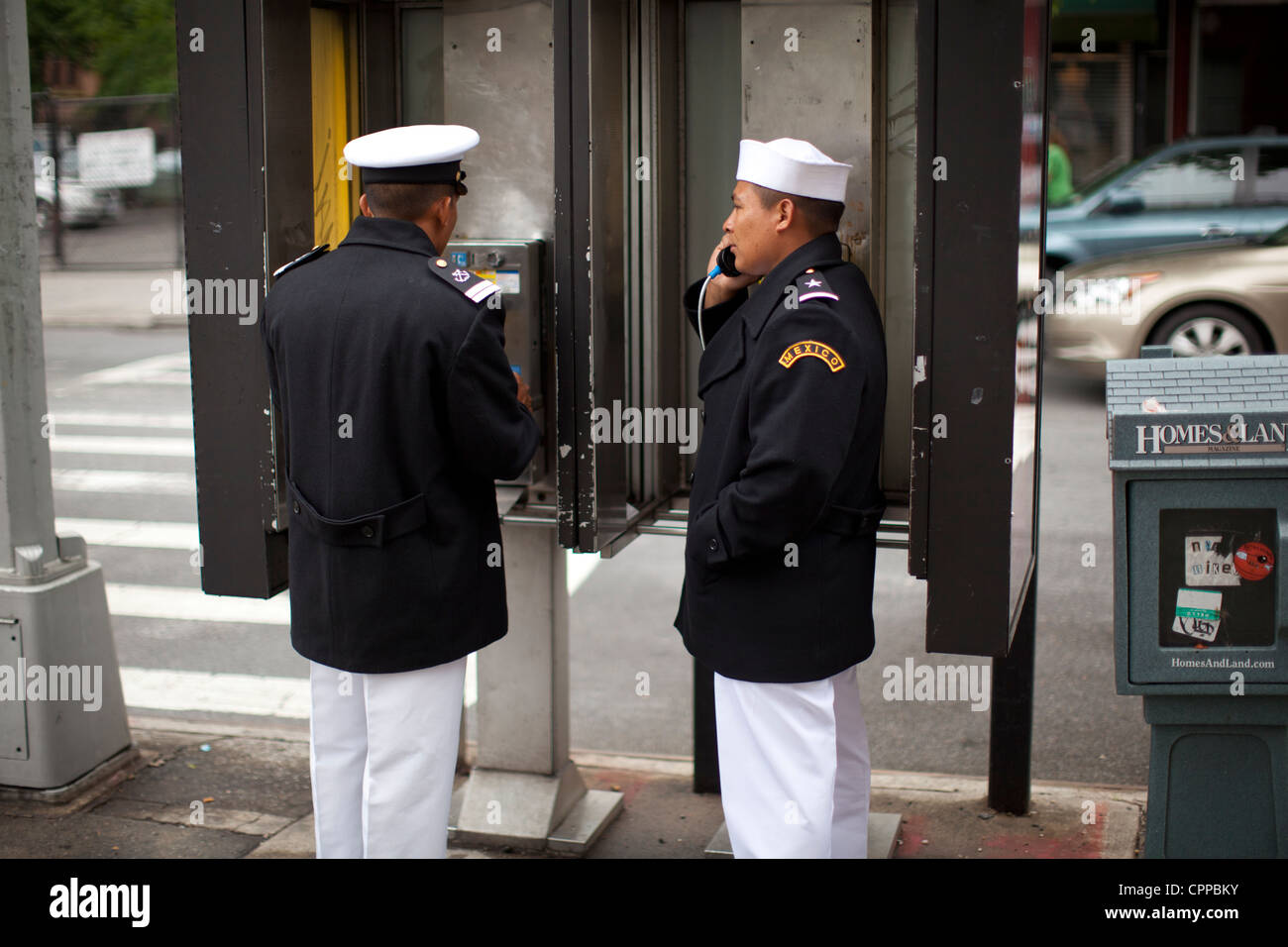 Mexican sailors use pay phones along Court Street in Brooklyn, New York ...