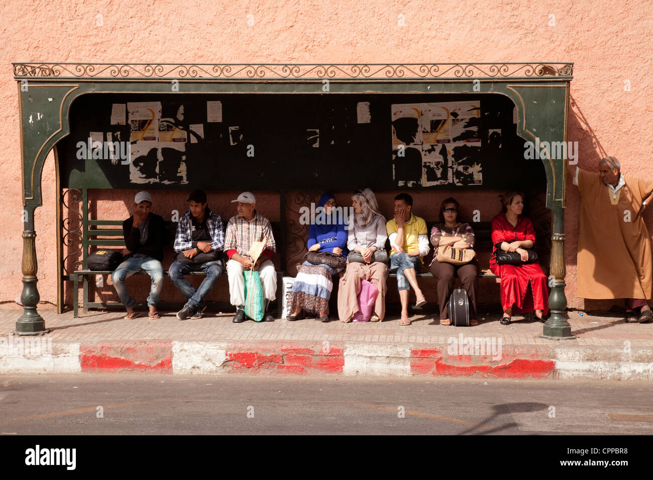 People waiting at a bus stop, Marrakech, Morocco, Africa Stock Photo ...