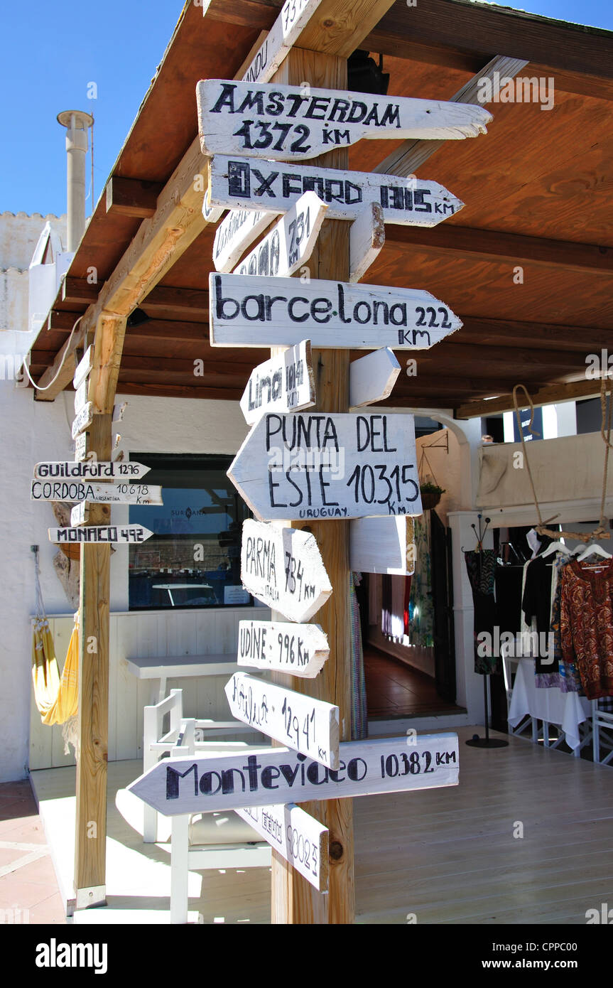 Destination distance signs outside small boutique, Fornells, Menorca ...