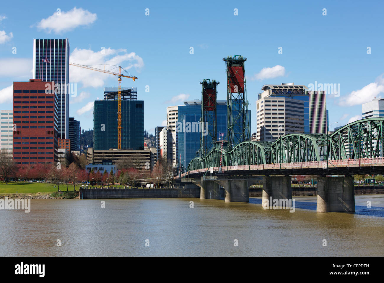 Portland City Green Steel Bridge and skyline with construction crane ...