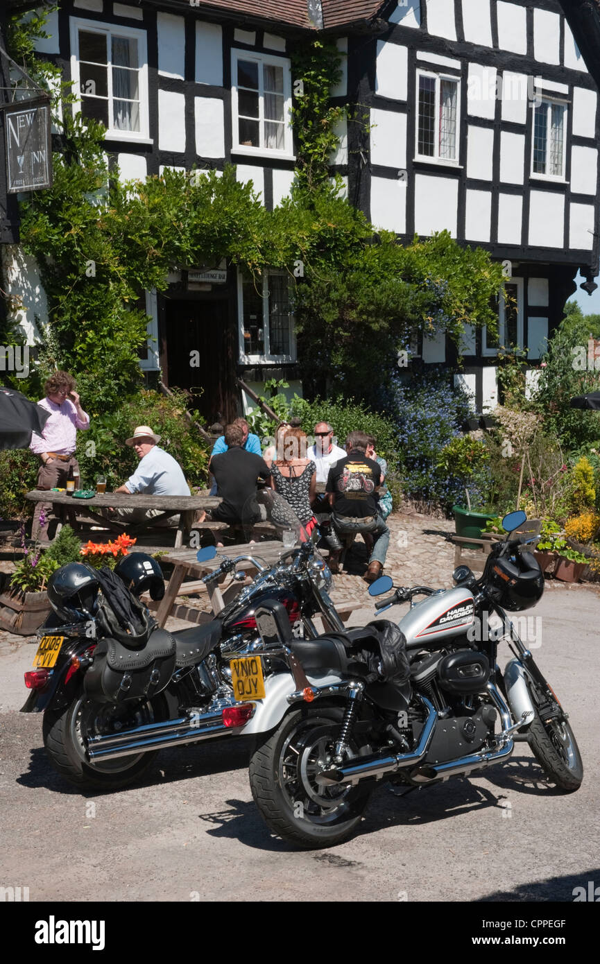 Drinking in the garden of The New Inn at Pembridge Stock Photo - Alamy