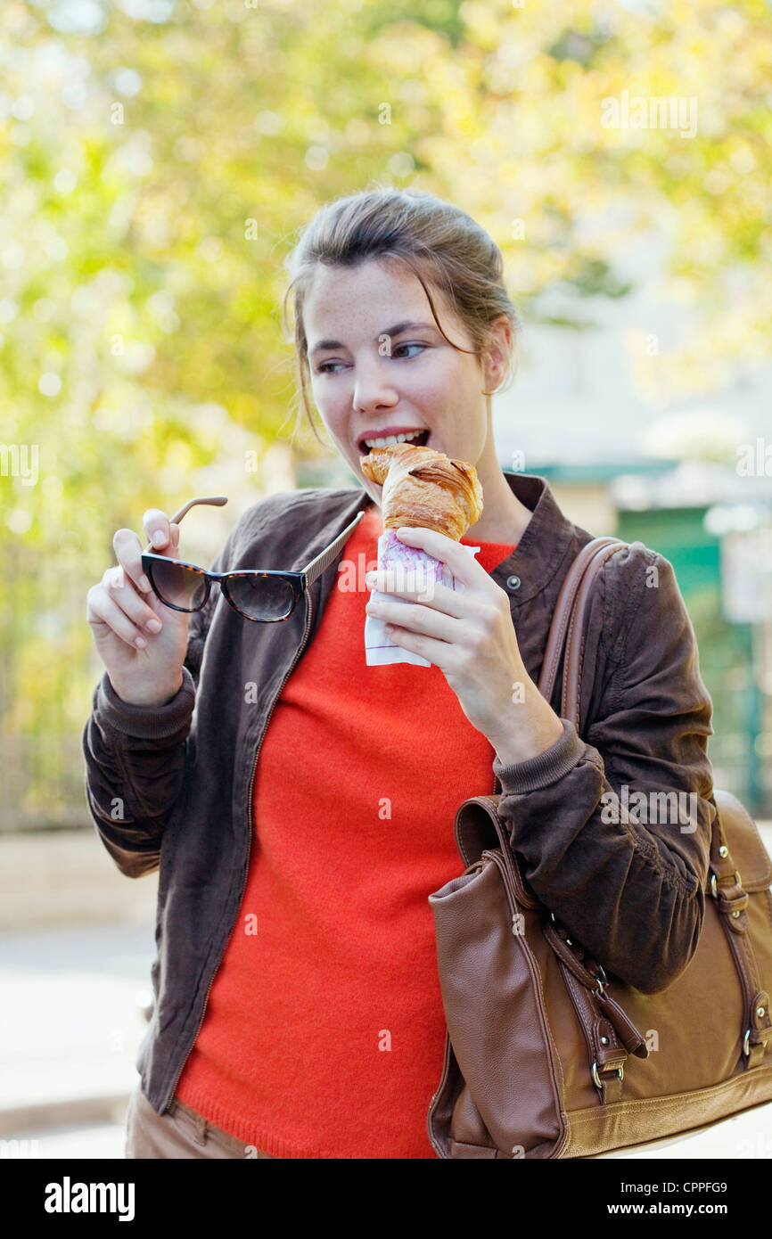 Greedy woman eating outdoors hi-res stock photography and images - Alamy