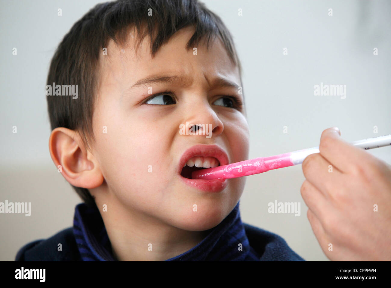 CHILD TAKING MEDICATION Stock Photo - Alamy