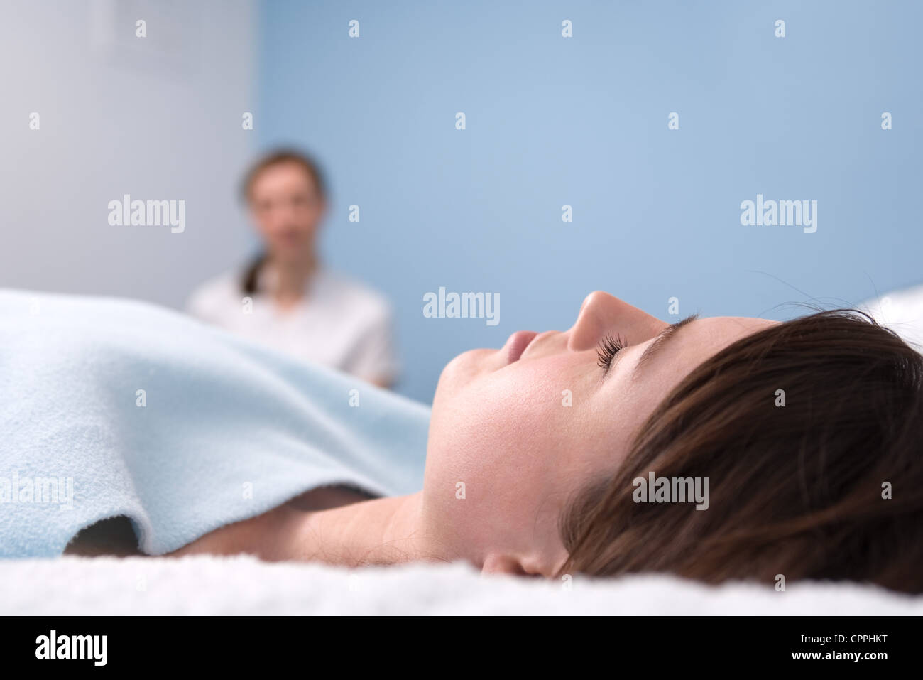 Nurse watching sleeping patient Stock Photo - Alamy