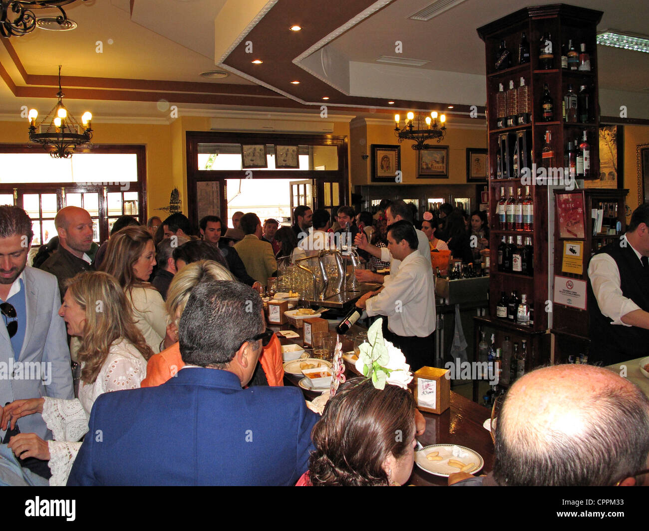 Spain Andalusia Seville people having lunch Tapas in Bodega wine cellar ...