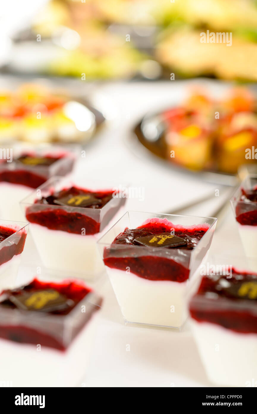 Appetizers mini desserts on catering buffet white tablecloth Stock ...