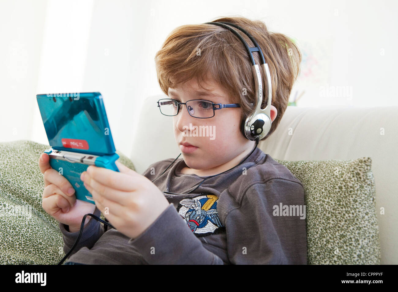 CHILD PLAYING WITH VIDEO GAME Stock Photo - Alamy