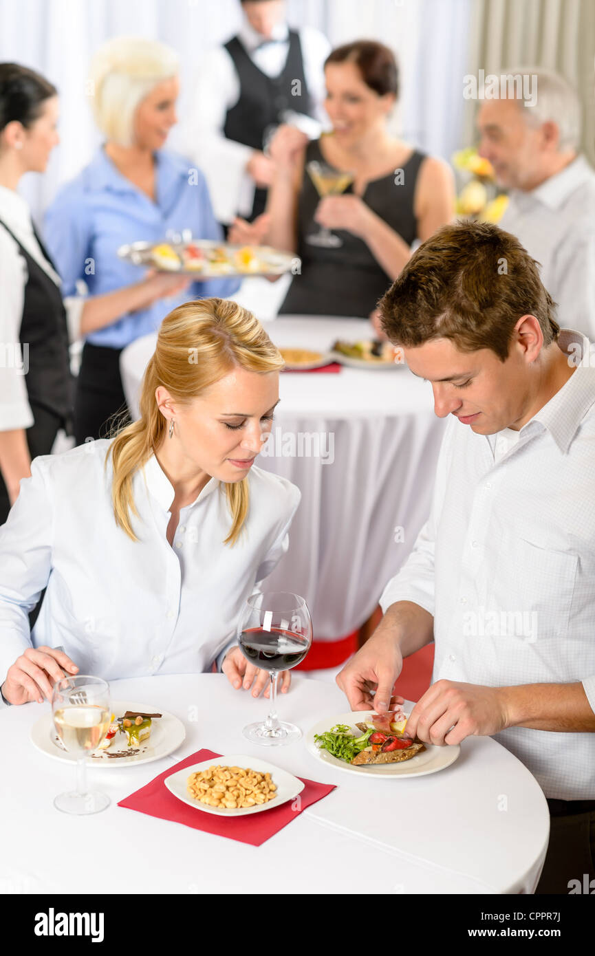 Catering company event young colleagues eating at buffet party Stock ...