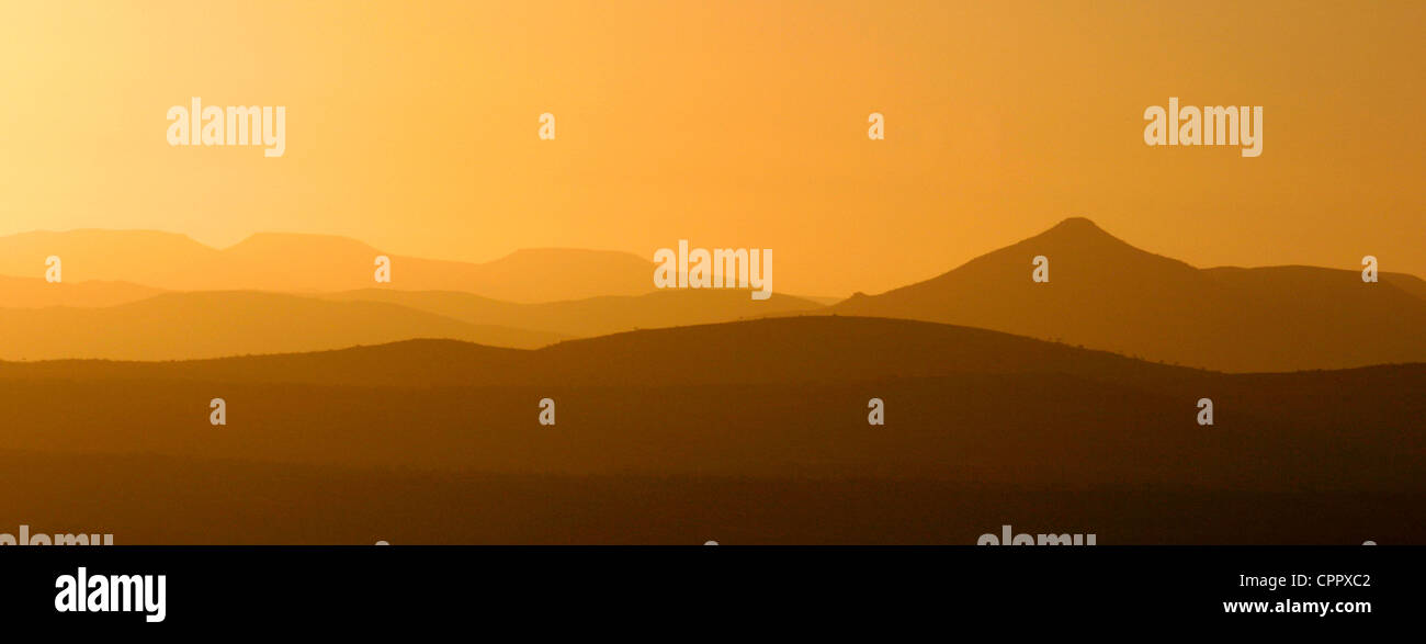 The beautiful colours in a Namibian clear sky sunset occur when there ...
