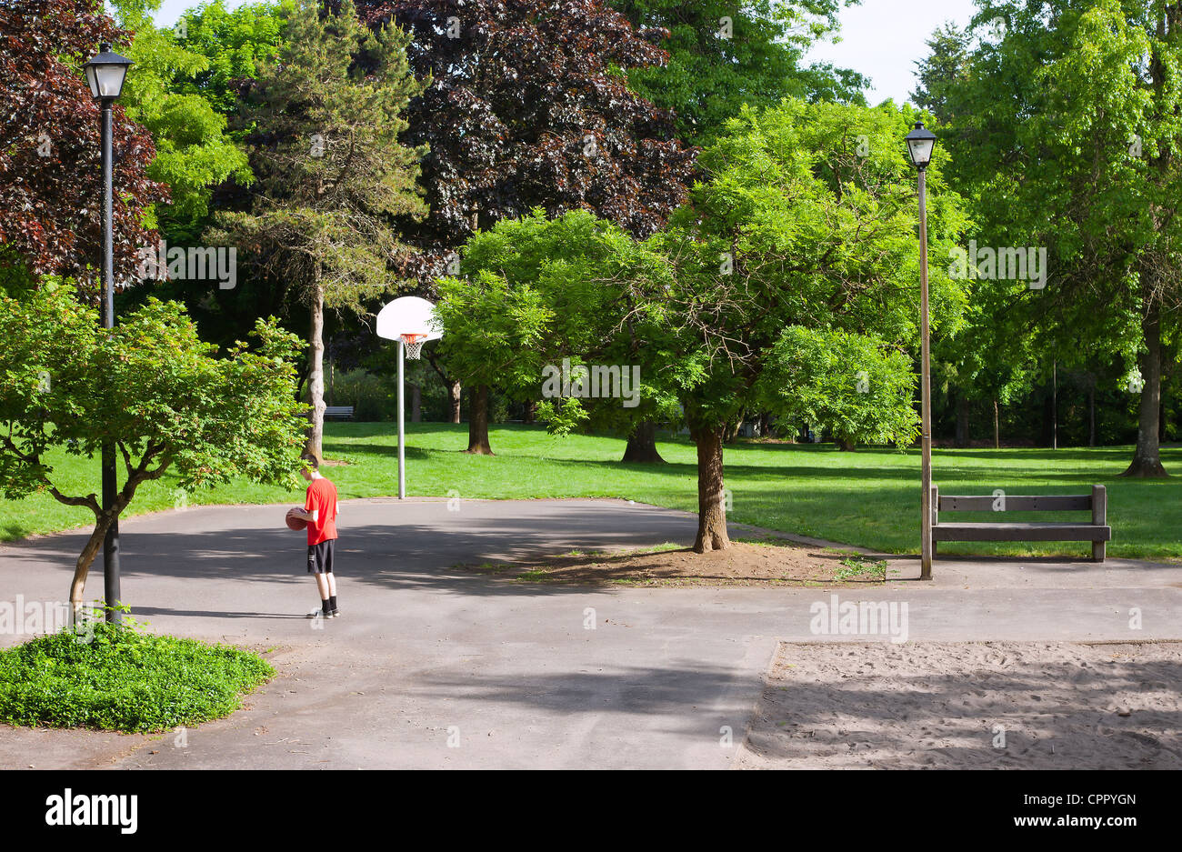 Park grass trees bench playground hi-res stock photography and images ...