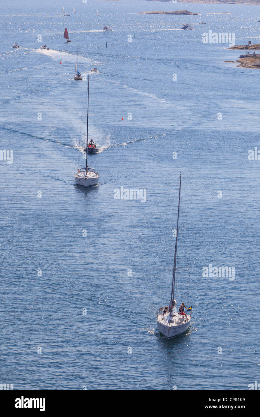 Sailboats on line at sea Stock Photo - Alamy