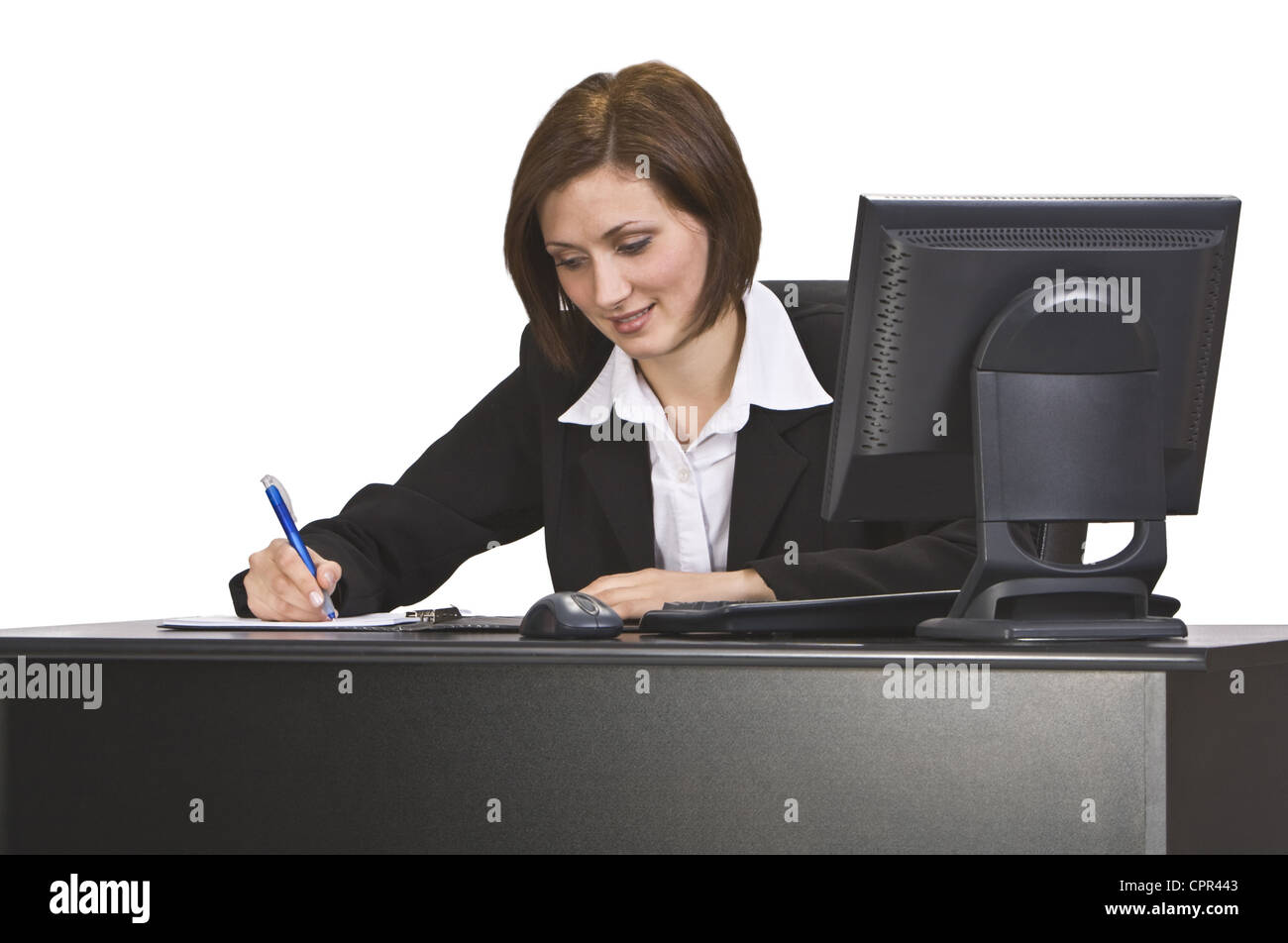 Young businesswoman taking notes at her desk Stock Photo - Alamy