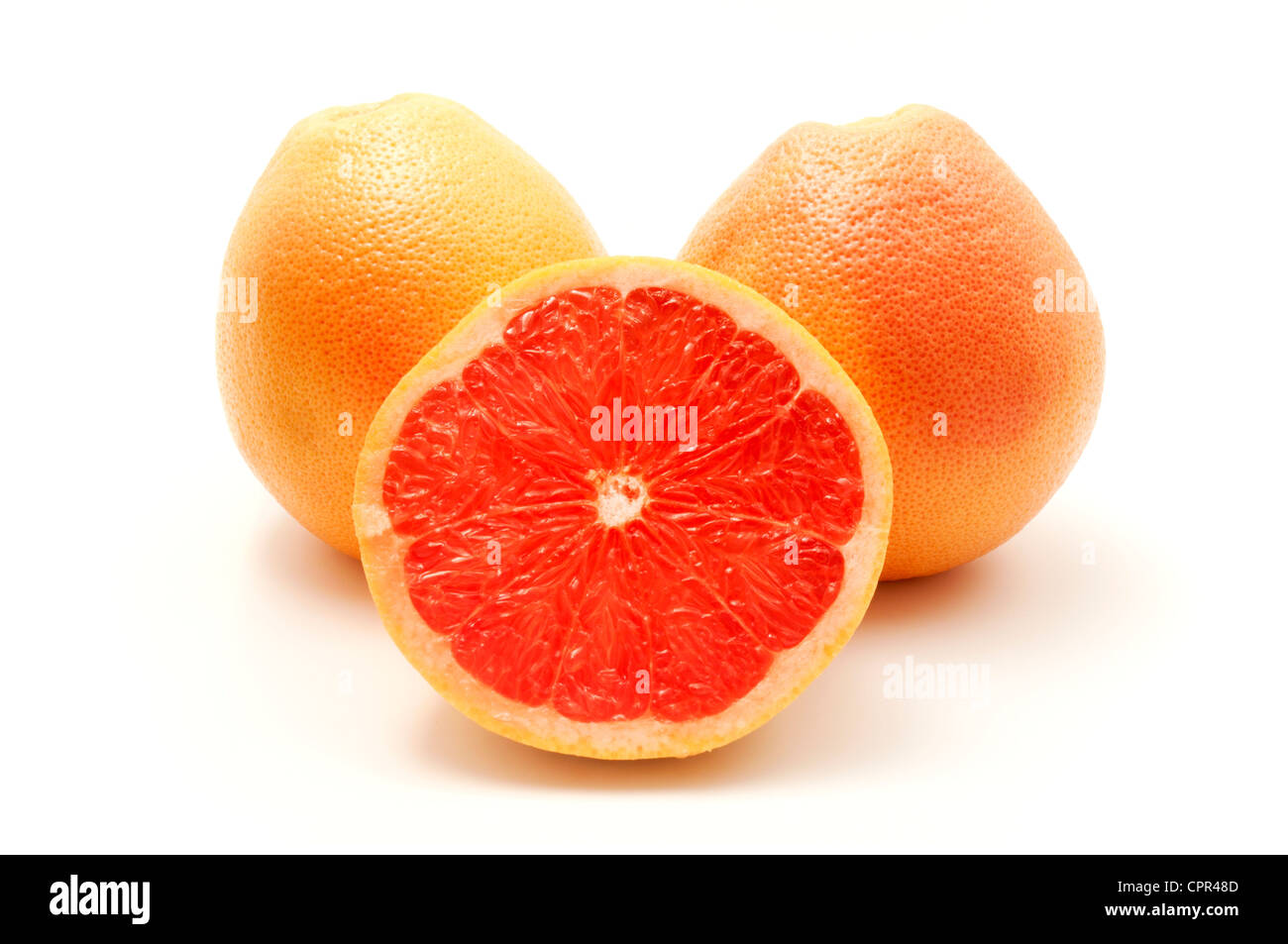 Pink grapefruit on a white background Stock Photo - Alamy