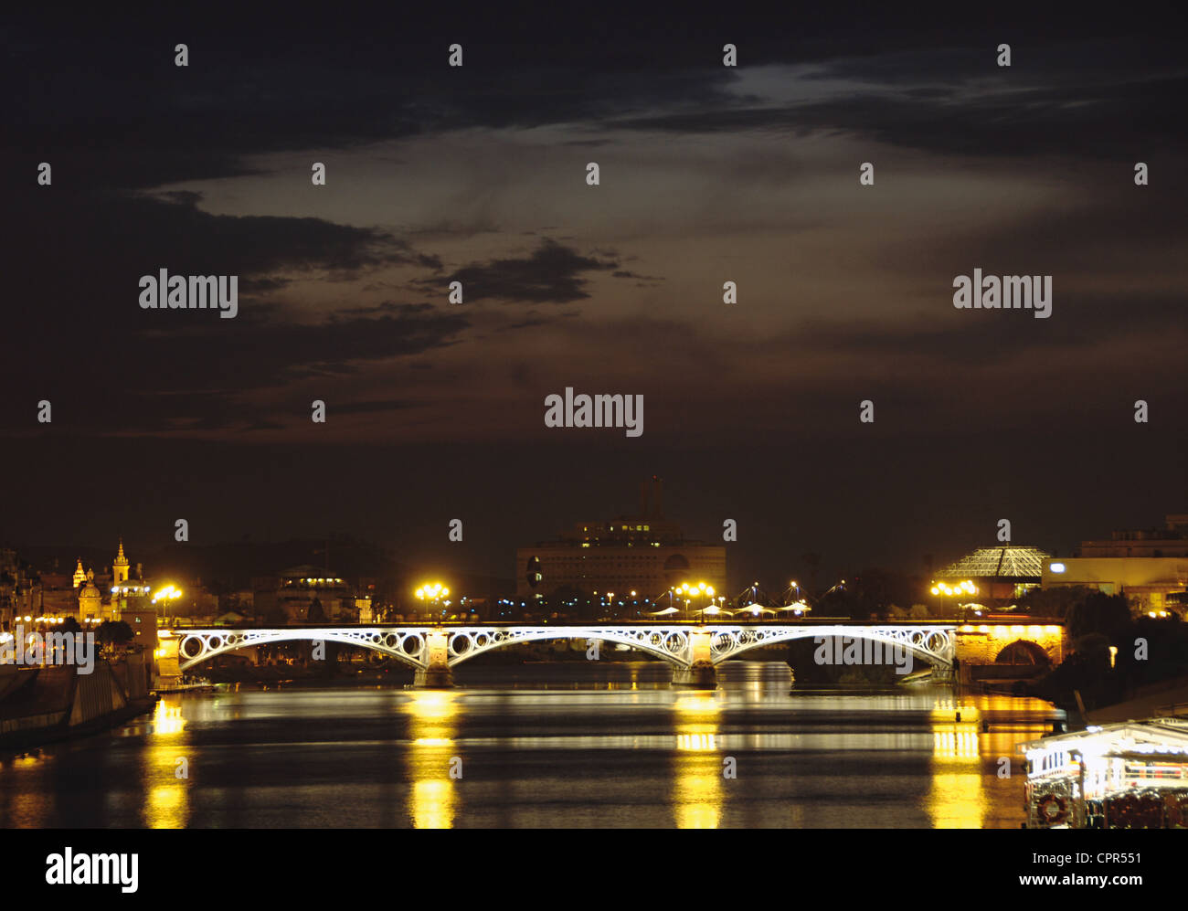 Spain. Andalusia. Seville. Night view of Isabel II Bridge, also known ...