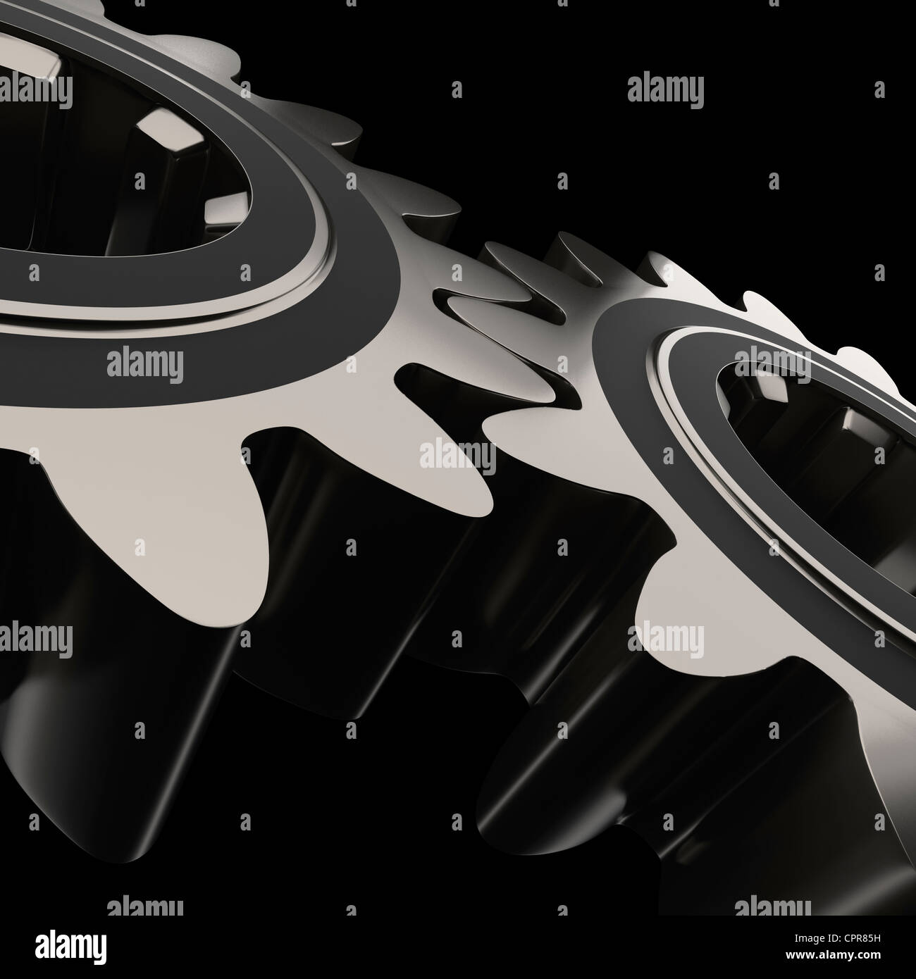 Two metal gears meshing together on black background Stock Photo - Alamy